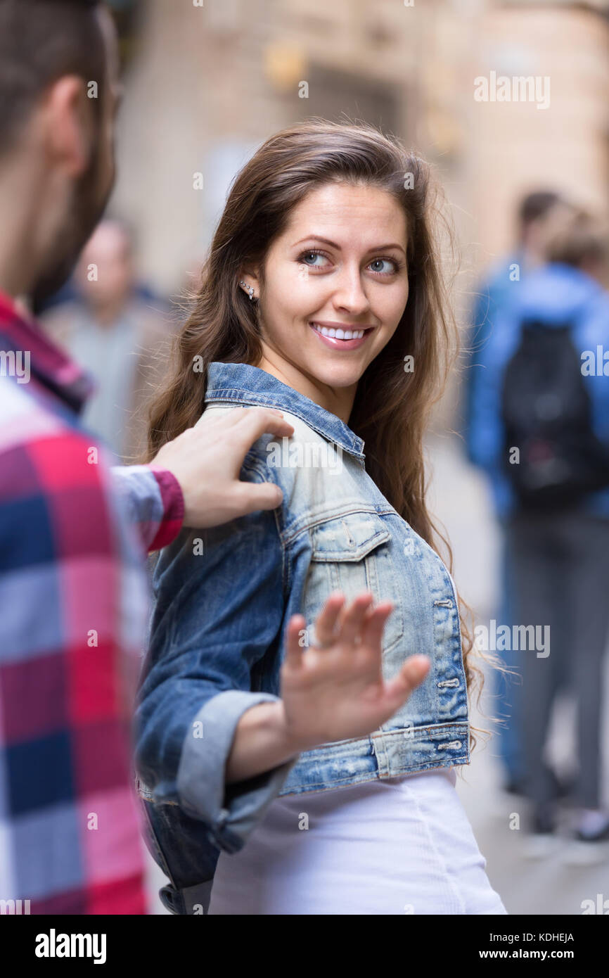 Happy female smiling back at nice-looking male stranger Stock Photo - Alamy