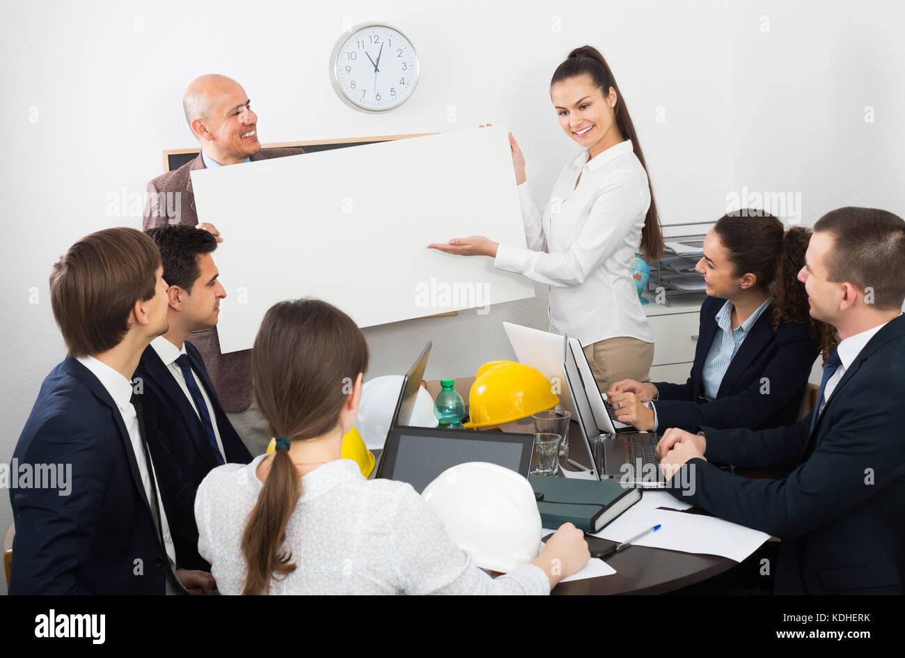 Presenting products, smiling hi-res stock photography and images - Alamy