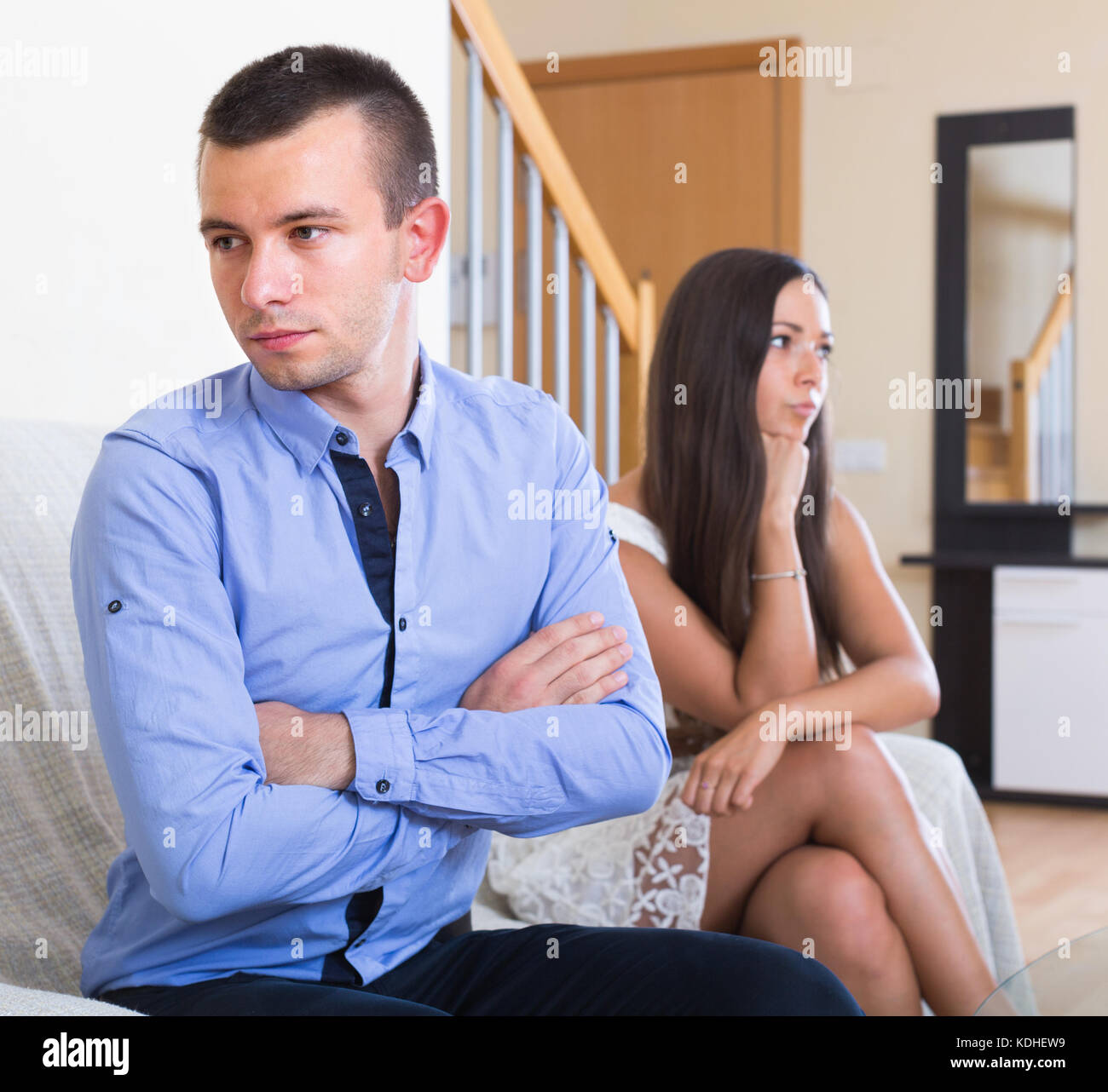 Young spouses sulking on each other during quarrel at home Stock Photo ...