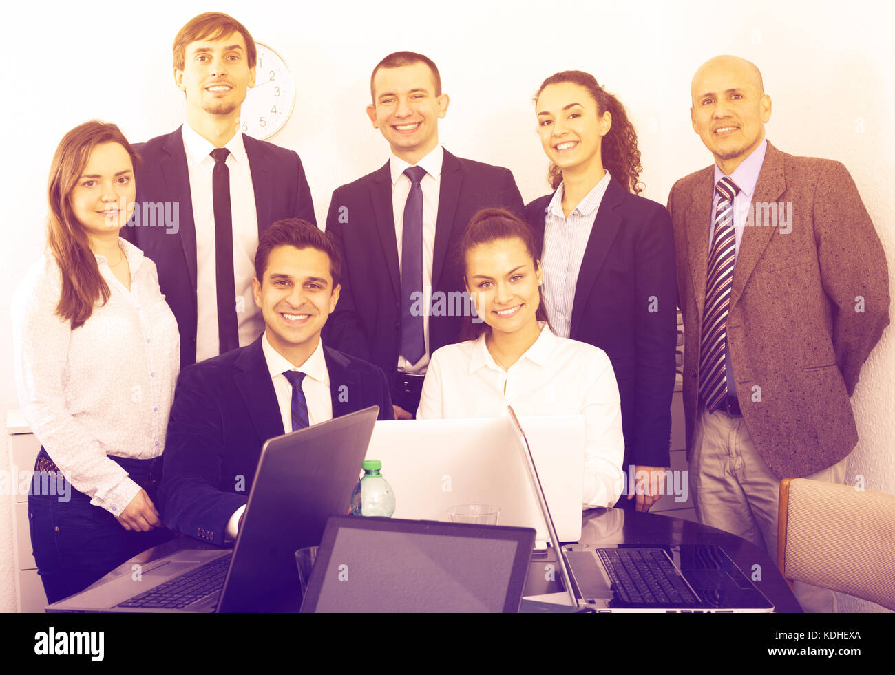 Portrait of positive business team smiling and posing in office Stock ...