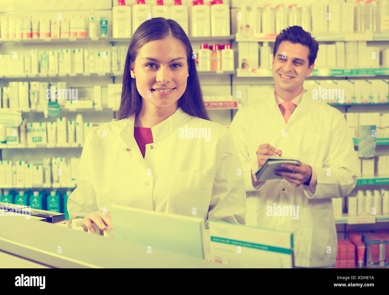 positive pharmacist and pharmacy technician posing in drugstore Stock ...