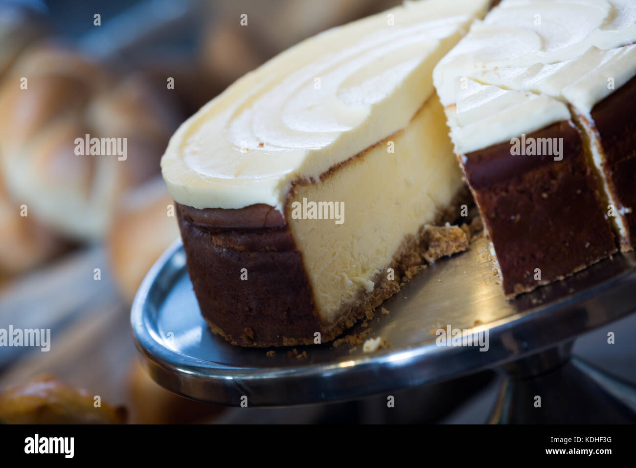 Tasty sponge cake with sugary icing at confectionary display Stock ...