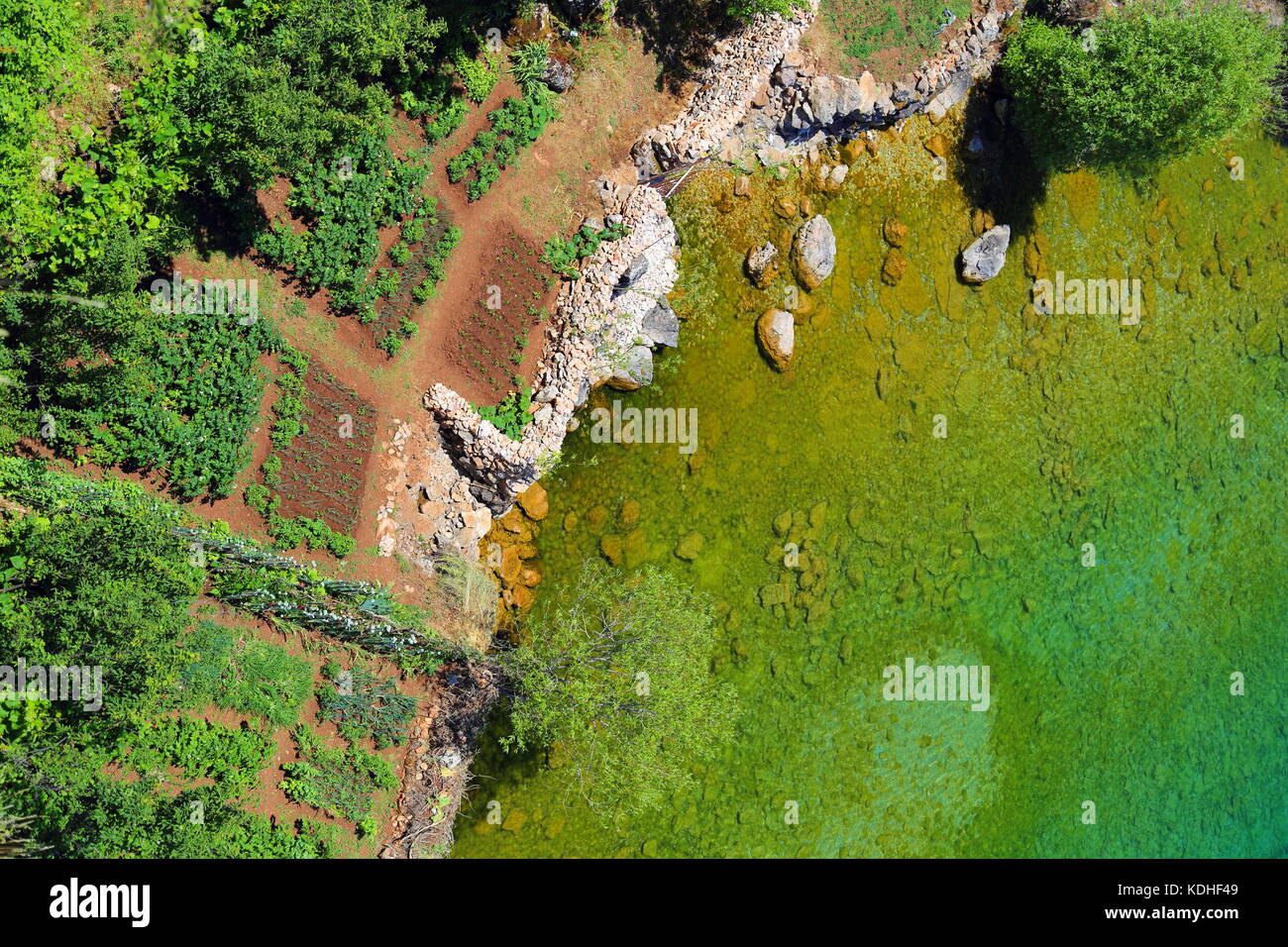Clear waters and lake shore gardens that represent traditional land use ...