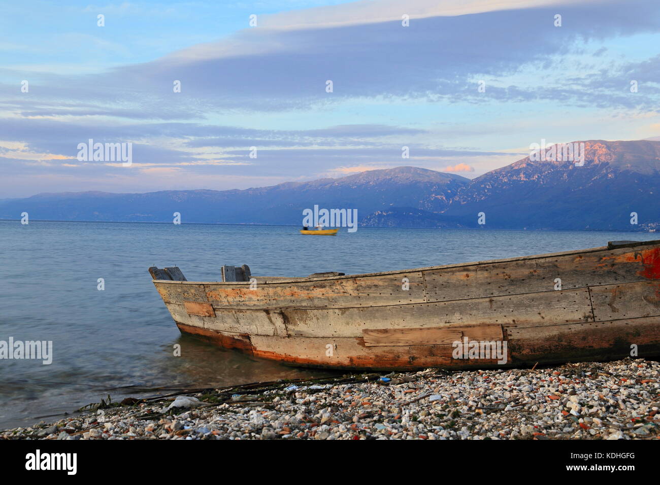 Wooden fishing boats moored on the beach of Lake Ohrid in Pogradec ...