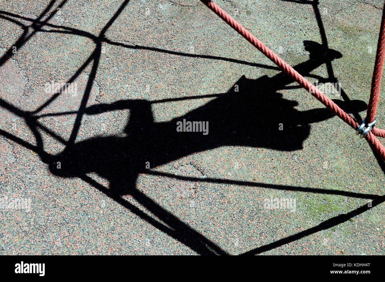 Girl kid shadow on game portal, play area with ropes to climb on Stock ...