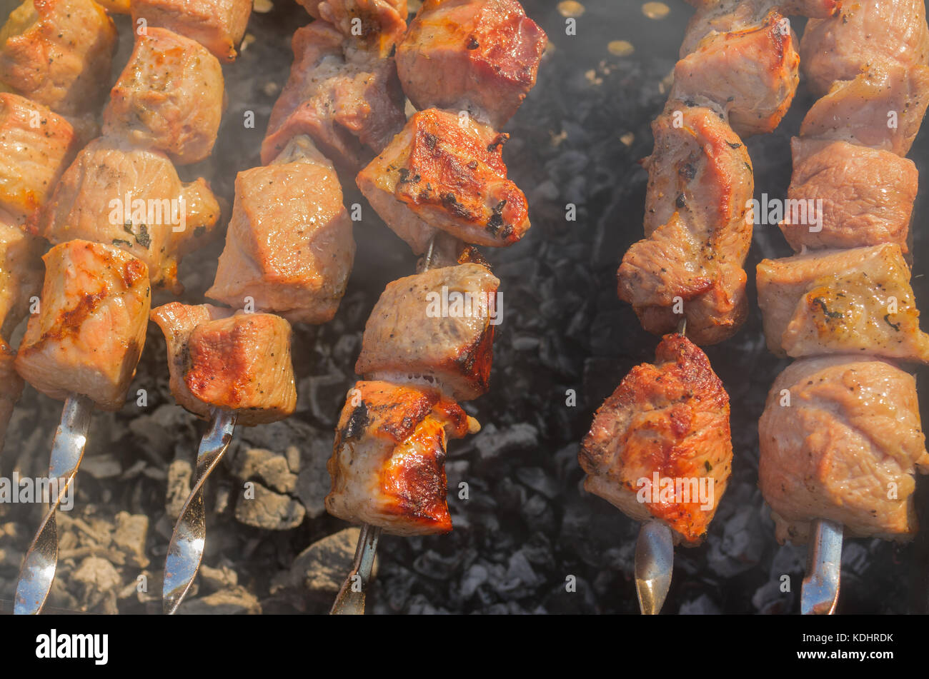 Juicy pork meat cooked outdoor on smouldering carbons Stock Photo - Alamy