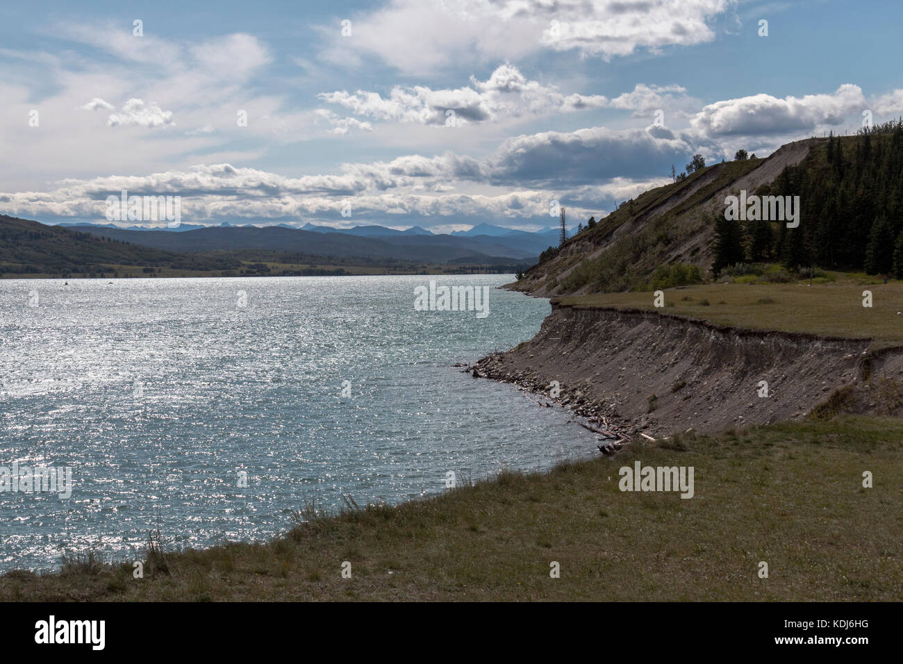 A vertical shot of the shoreline of Ghost Lake in Alberta, Canada Stock ...