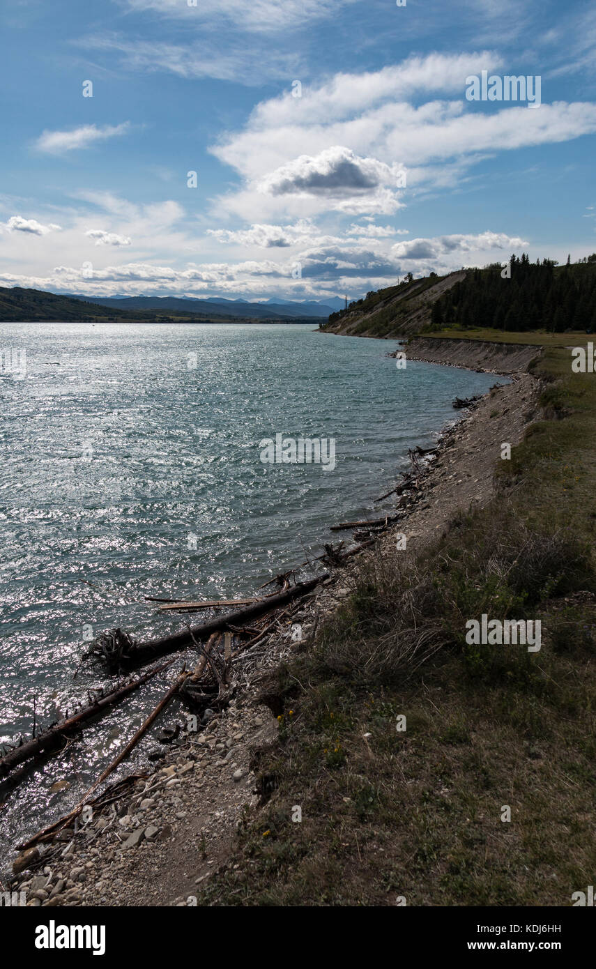 The shore of Ghost Lake (Alberta, Canada) with the Canadian Rockies ...