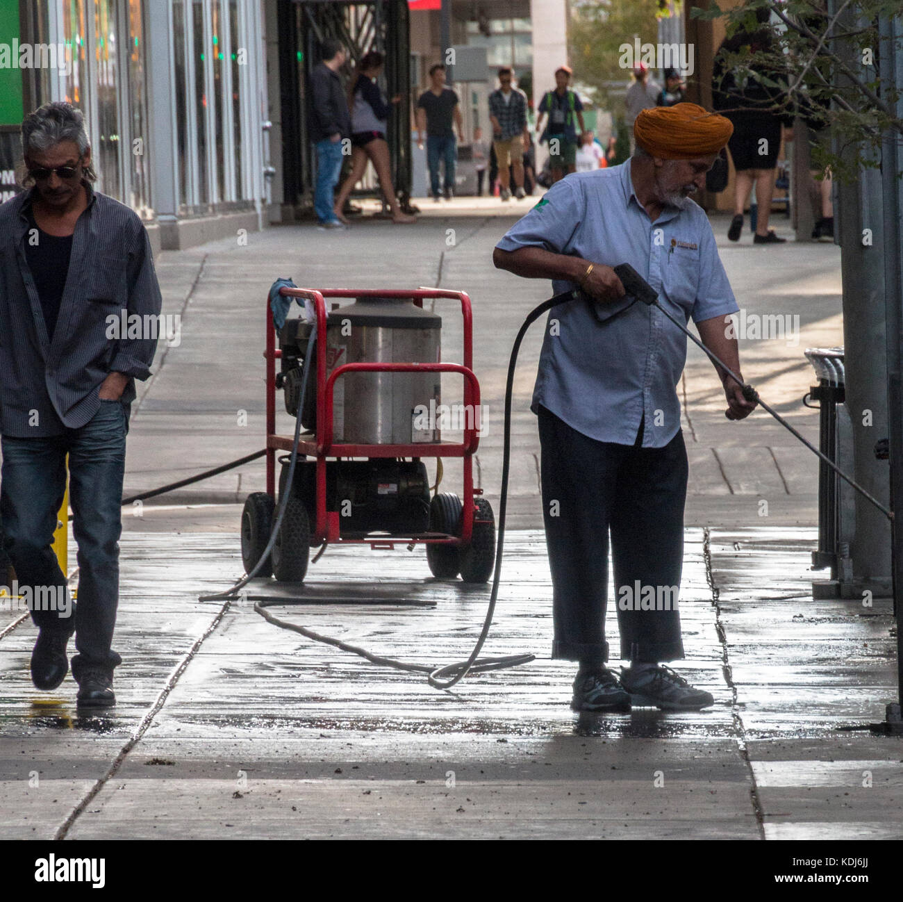 Calgary, Alberta/Canada – August 30, 2015: A man pressure-washing a ...