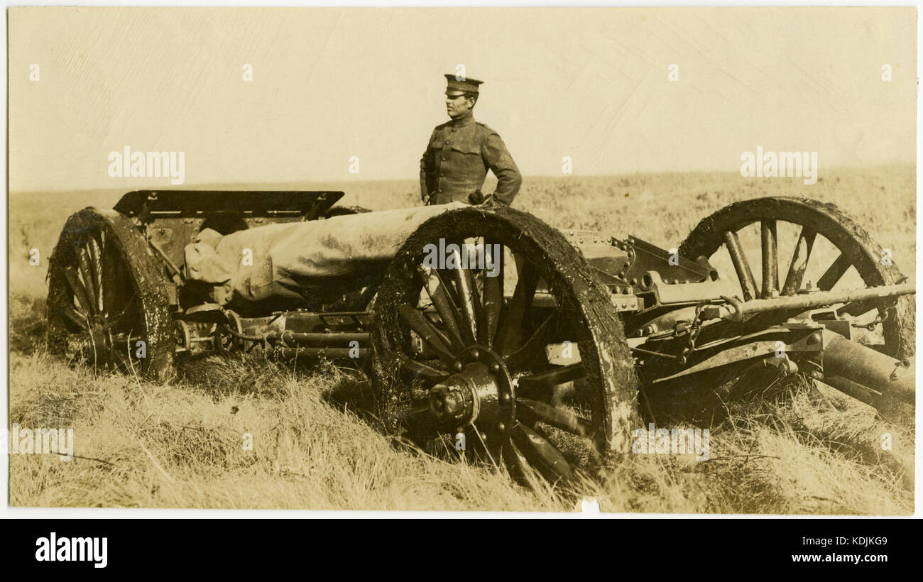 Soldier Standing Next to Artillery Gun Stock Photo - Alamy