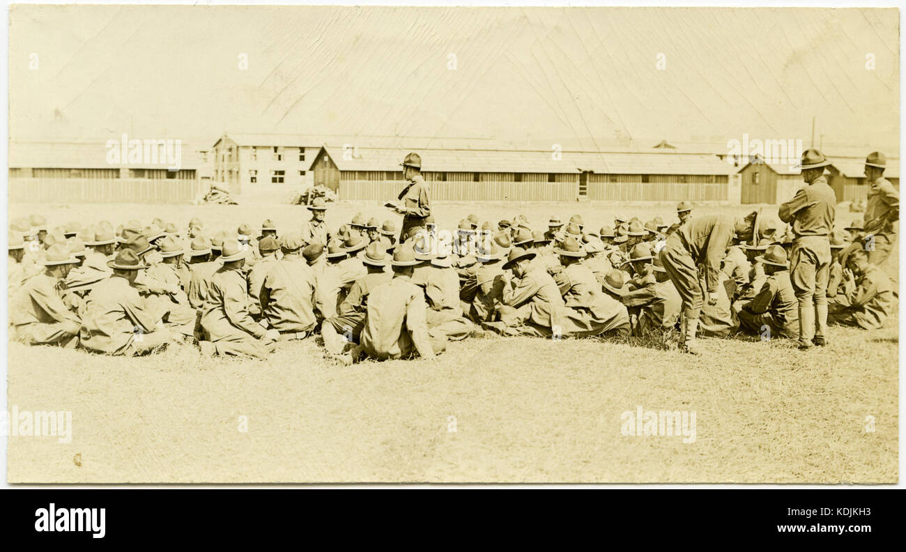Soldiers Seated on the Ground in a Group Listening to One Soldier in ...