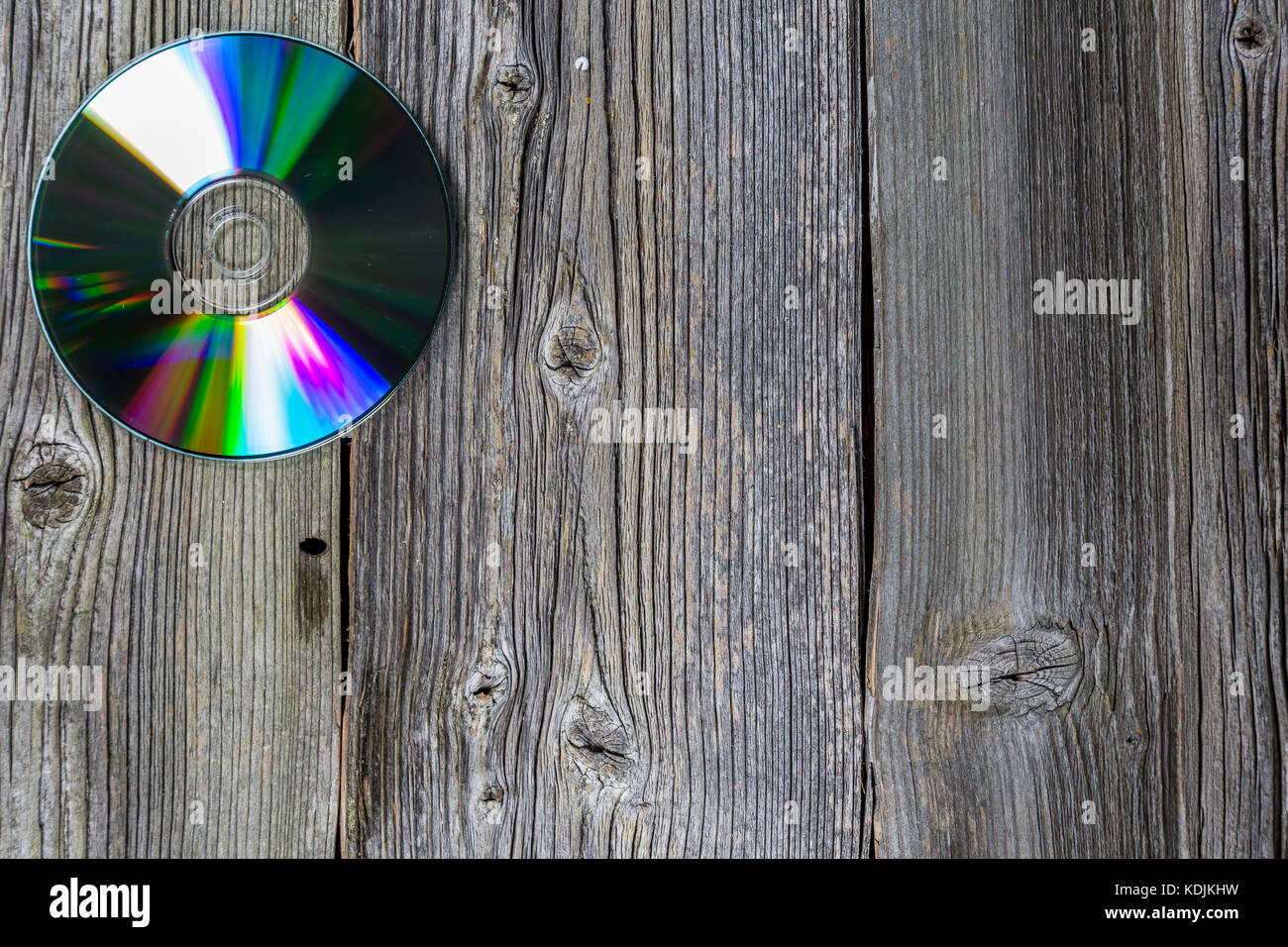 CD disk on dark wooden table. Top view. Wood texture Stock Photo - Alamy