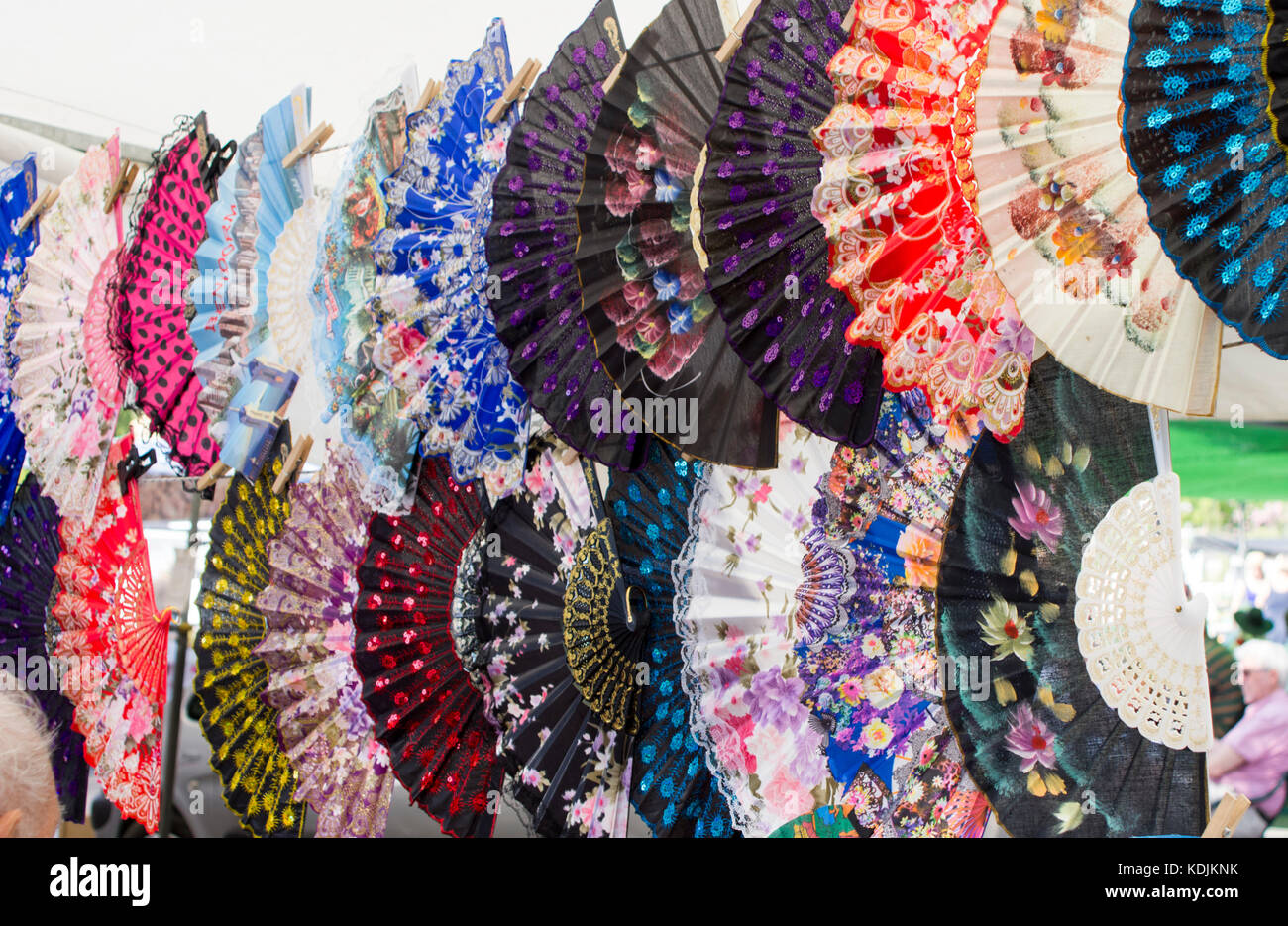 A display of colourful painted fans on a Spanish market stall Stock ...