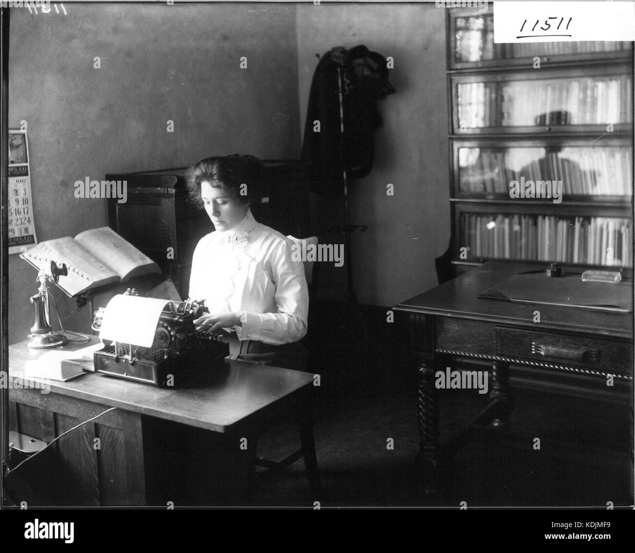 Secretary at typewriter 1912 (3192197470 Stock Photo - Alamy