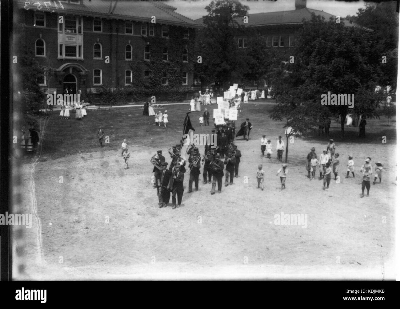 This image captures a procession during a commencement ceremony in 1912 ...
