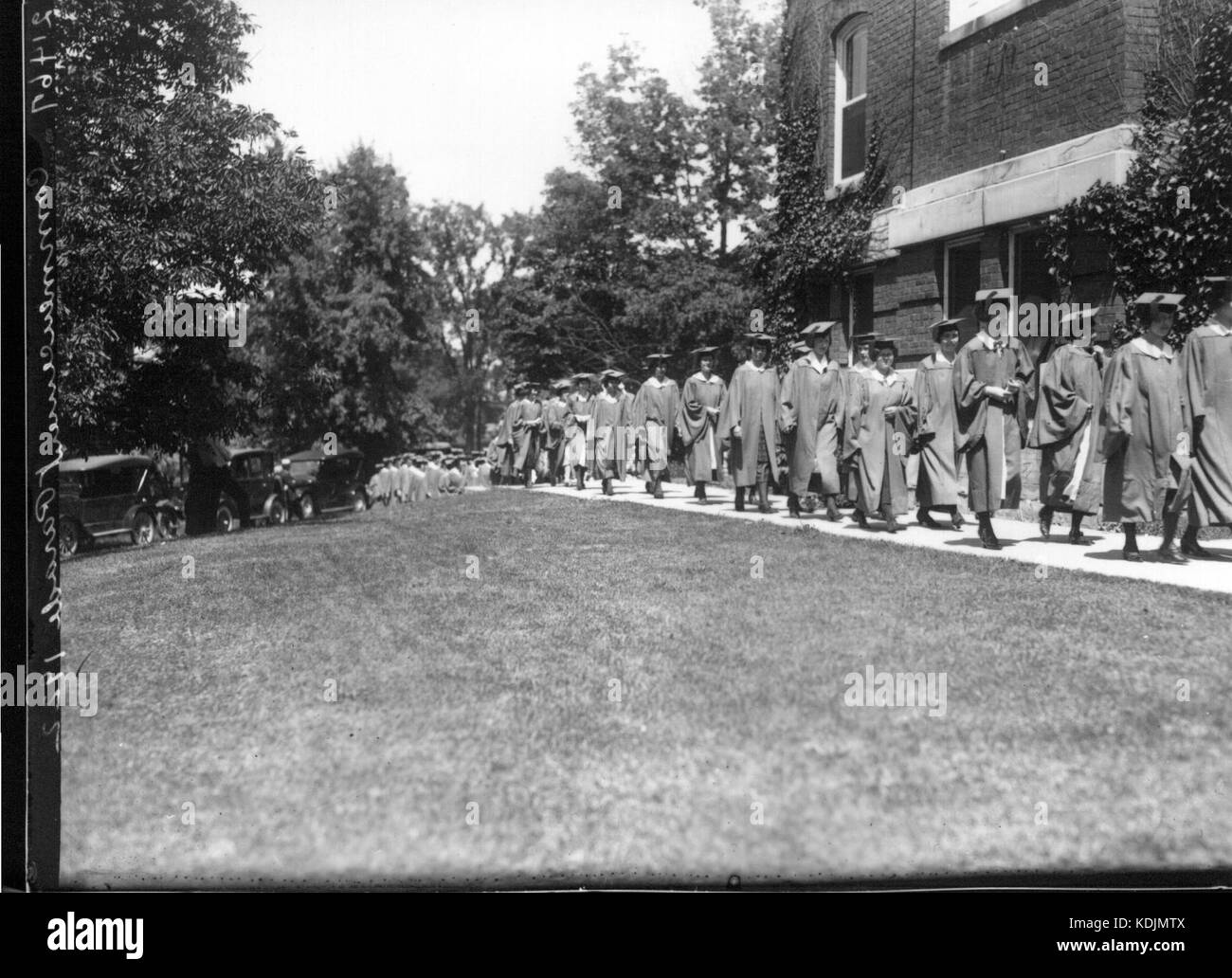 This image from 1922 captures a procession of graduates during a ...