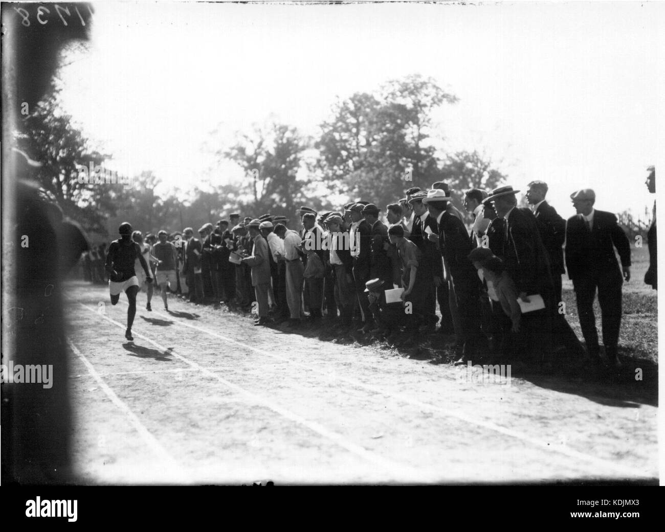 Runners, judges and spectators at high school track meet 1912 ...