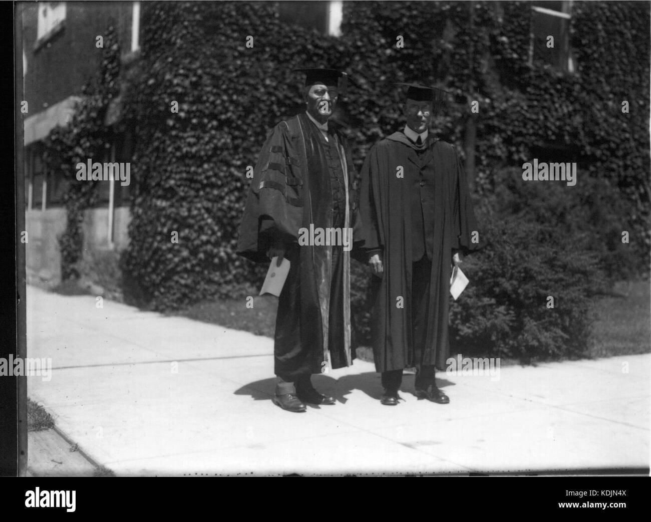 This photograph captures an honorary degree recipient with President ...