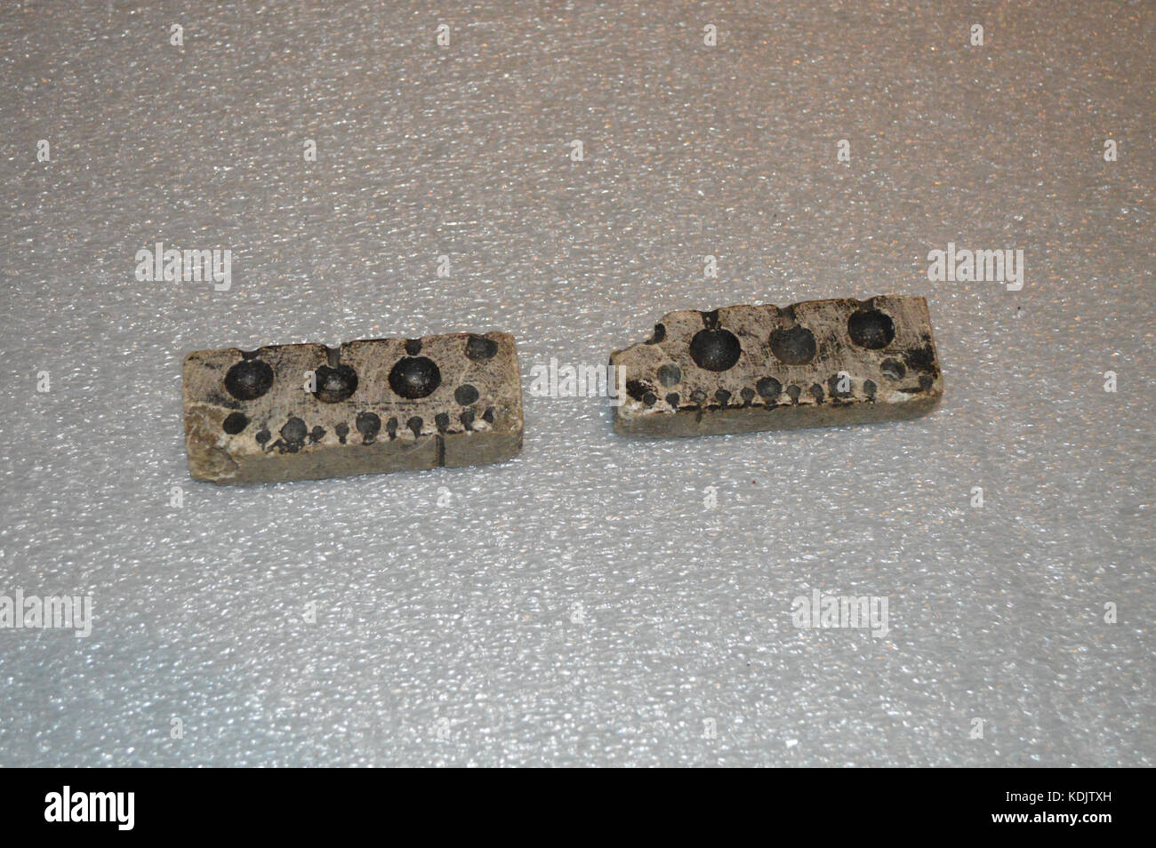 A soapstone bullet mold created by E.V. Papin, reflecting the use of ...