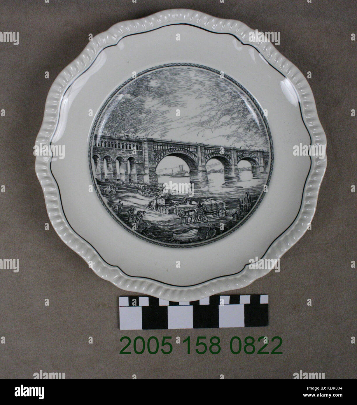 A large China plate featuring a black line drawing of St. Louis ...