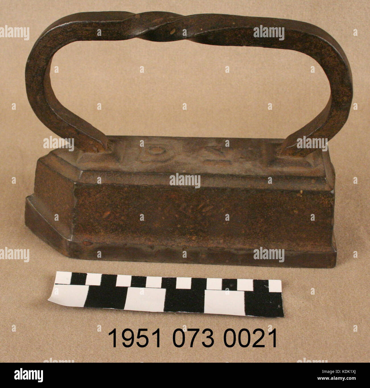 Sad Iron with twisted wrought iron handle Stock Photo - Alamy