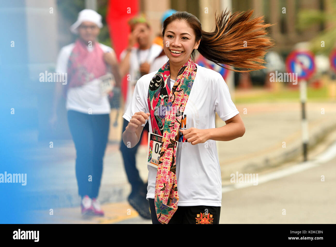 Putrajaya, Malaysia. 14th Oct, 2017. A woman takes part in the Batik ...