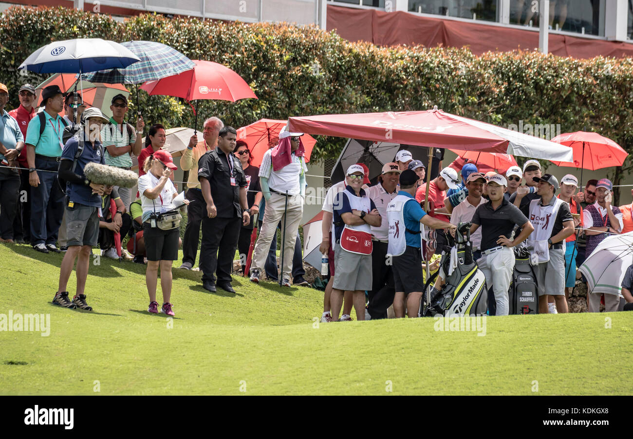 Kuala Lumpur, Malaysia. 14th October, 2017. A large crowd following Perez, Schauffele and Sung ...