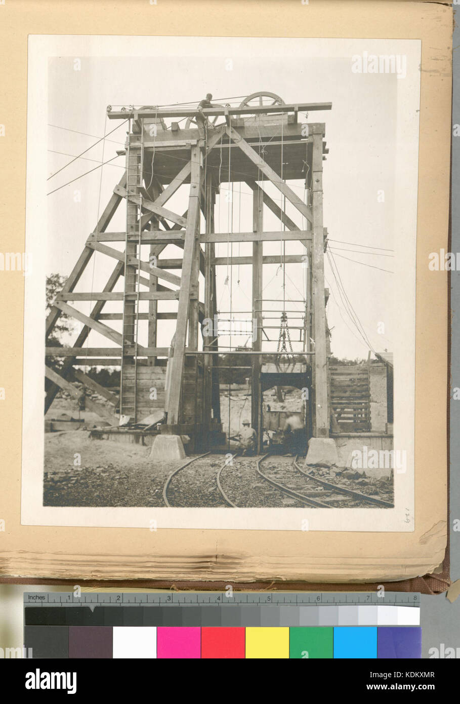 Rondout pressure tunnel. View of head frame and cage with muck car at ...