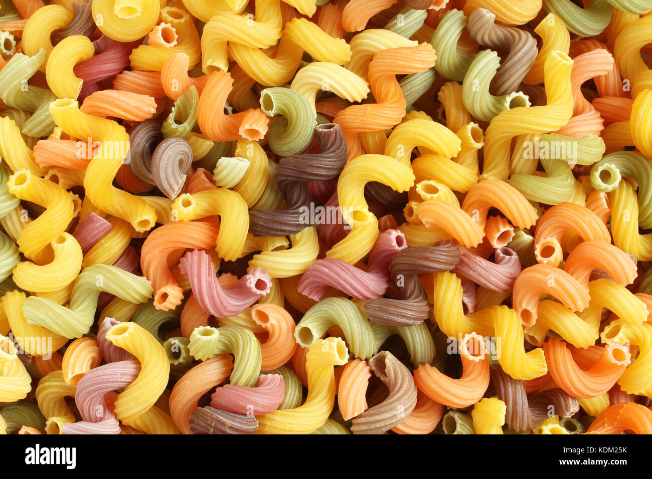 Food background - uncooked colorful Cavatappi (Celentani) durum wheat ...