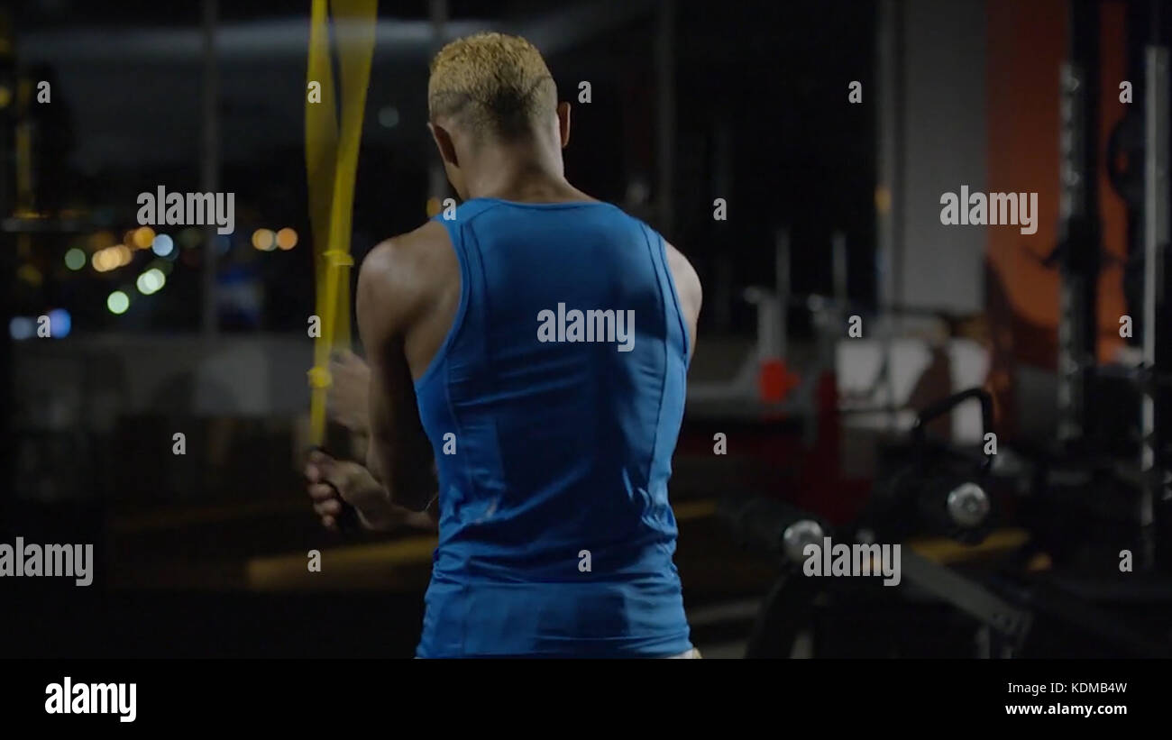 Muscular man skipping rope. Portrait of muscular young man exercising ...