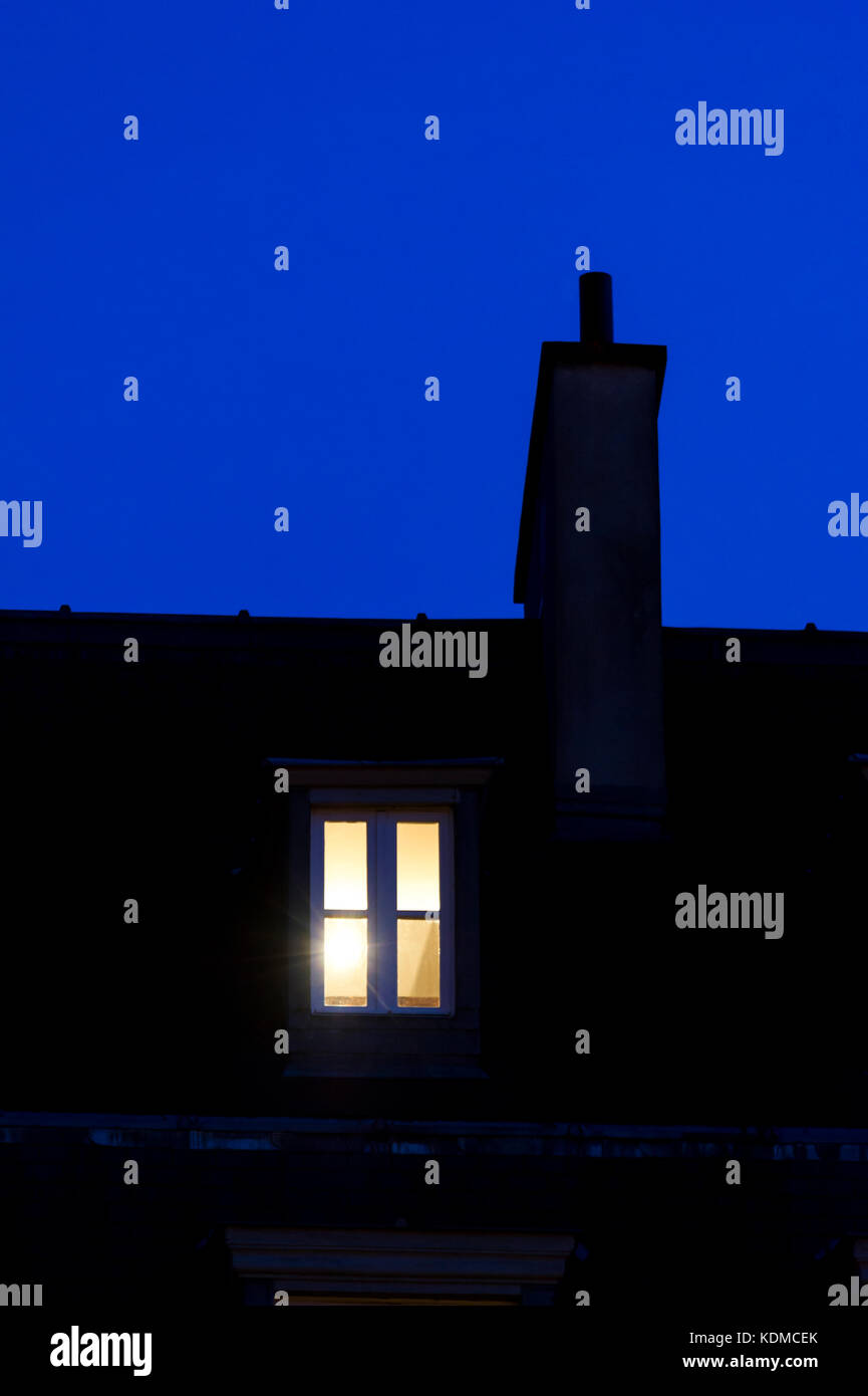 Lonely window illuminated at night Stock Photo - Alamy