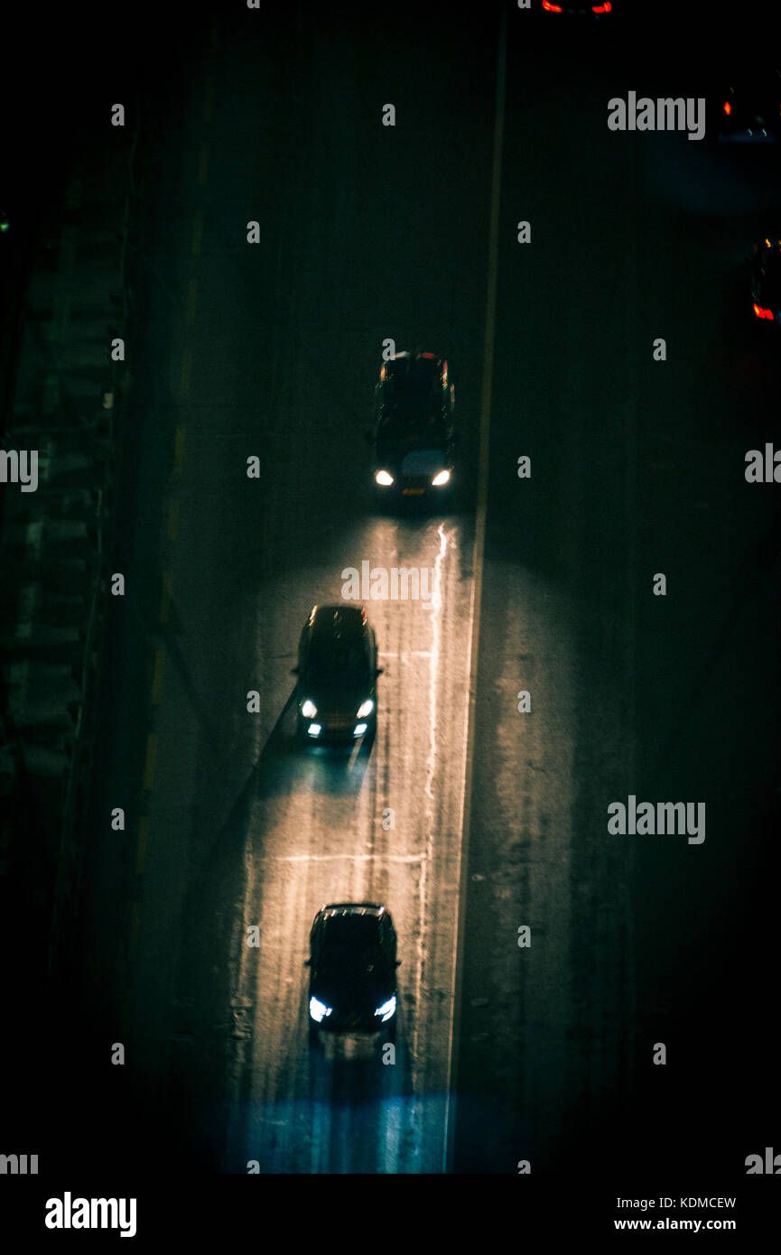 Road with cars moving at night Stock Photo - Alamy