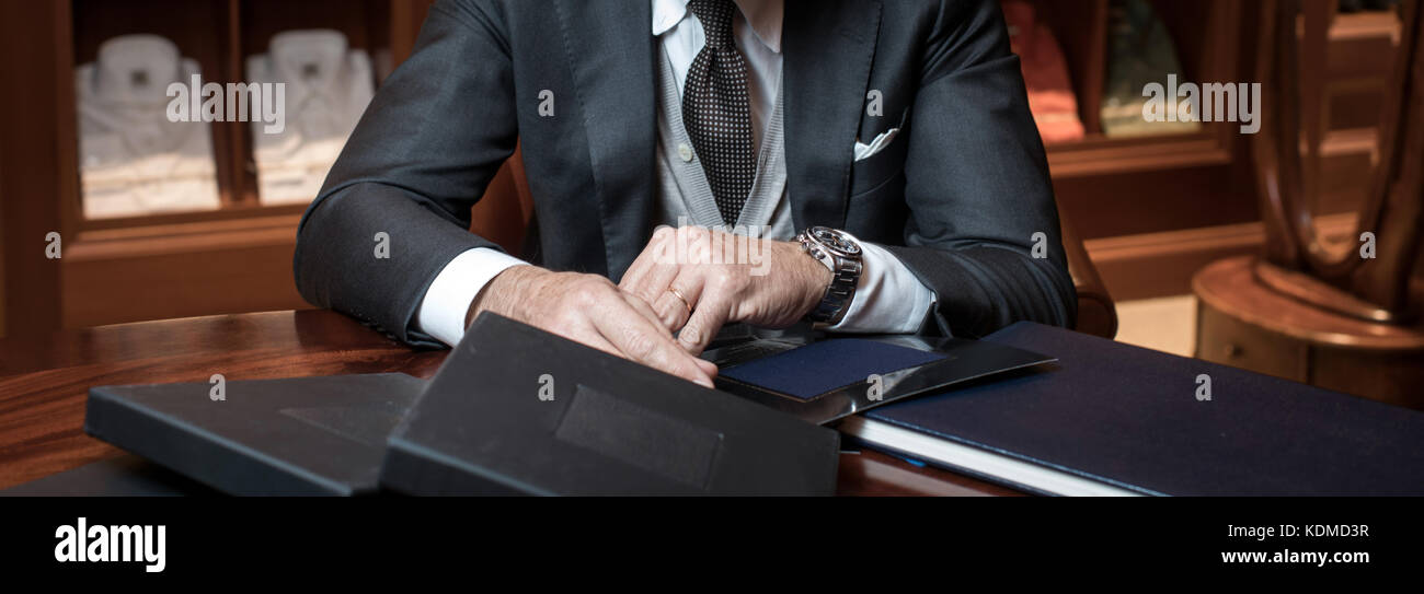 Stylish businessman at table Stock Photo - Alamy