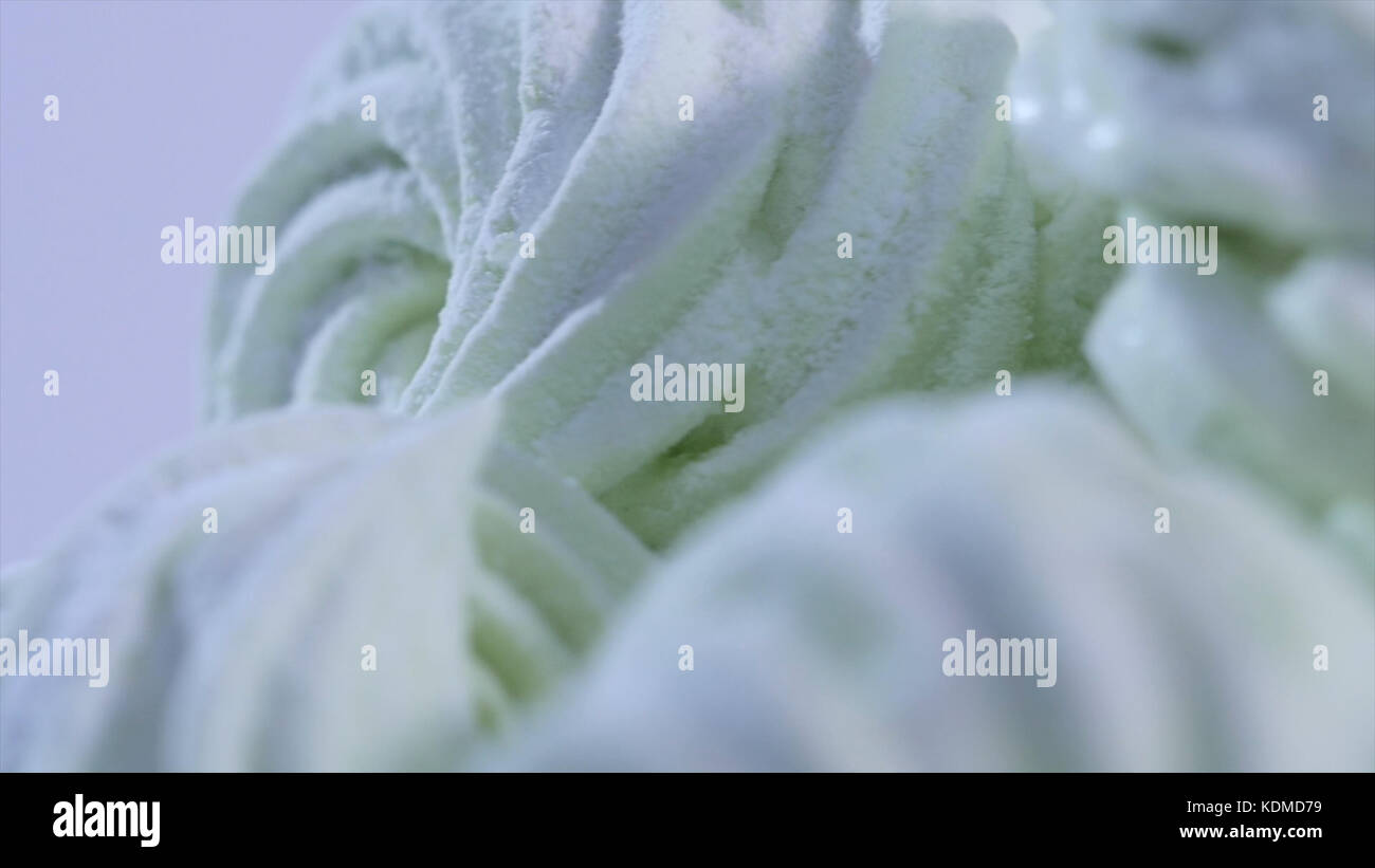 Fluffy white marshmallow in blue round bowl on old wooden table with ...