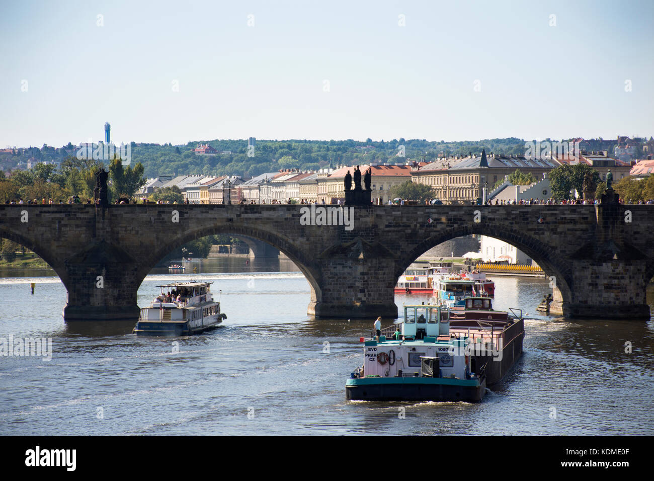 Barge and Tugboat cargo ship and River Cruises sailing in Vltava river ...