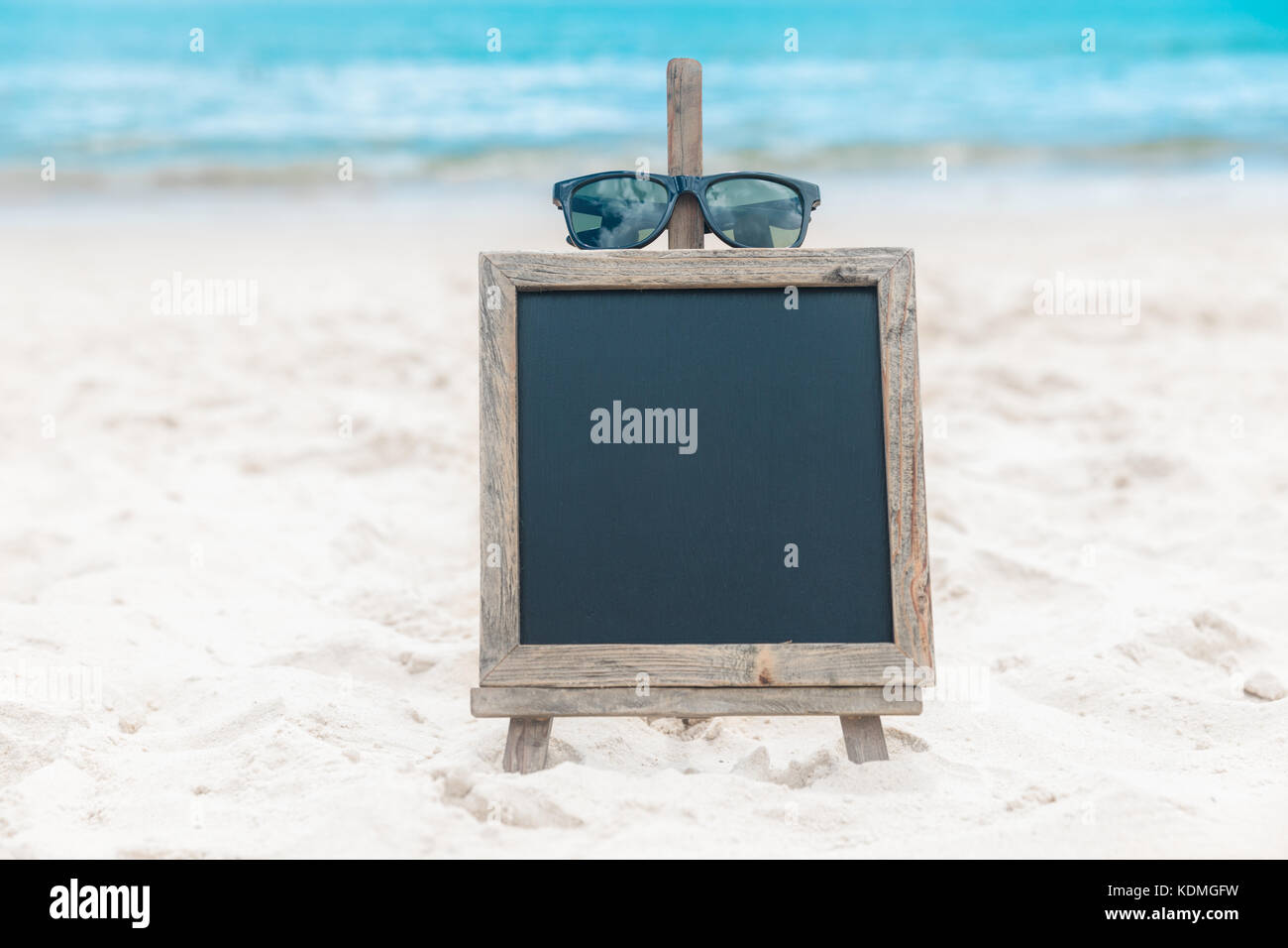 Chalk board with sunglasses in the sand on the beach tropic exotic ...
