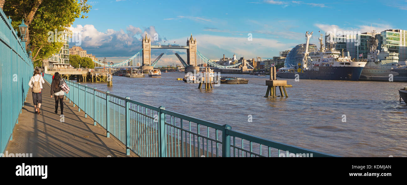 London - The promenade with the Tower bridge and the riverside in ...