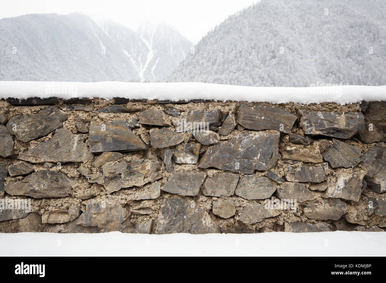 Bricks wall in snow Stock Photo - Alamy