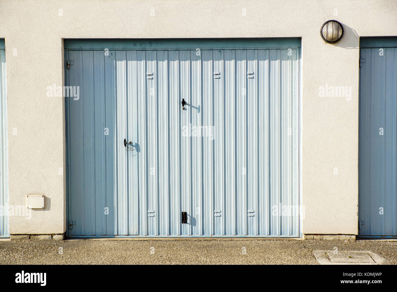 Garage wall facade with metal door background texture Stock Photo - Alamy
