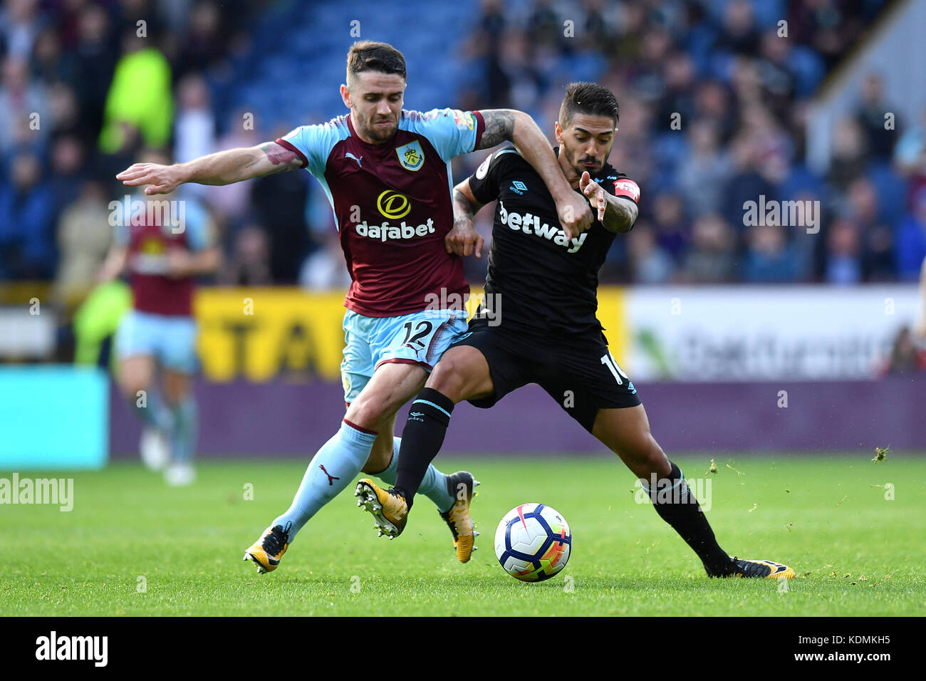 Burnley's Robbie Brady (left) and West Ham United's Manuel Lanzini ...