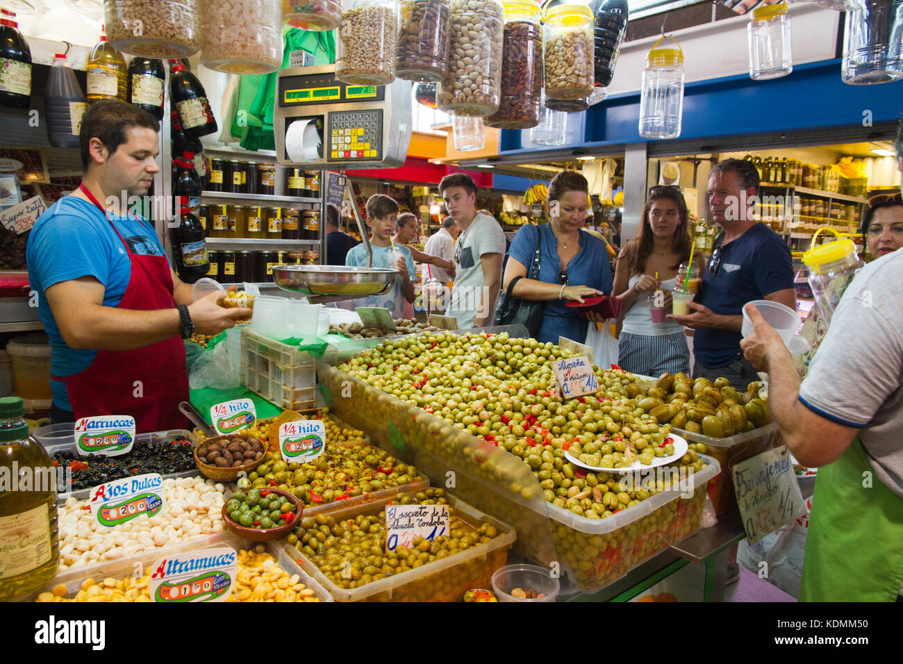 Malaga market, people shopping olives in a stall Stock Photo - Alamy