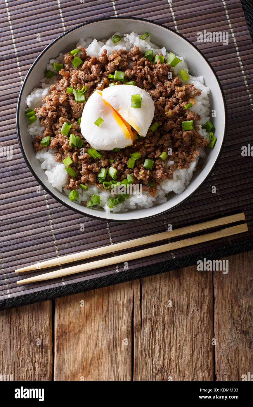 Japanese spicy beef Soboro with egg benedict, rice and green onion ...