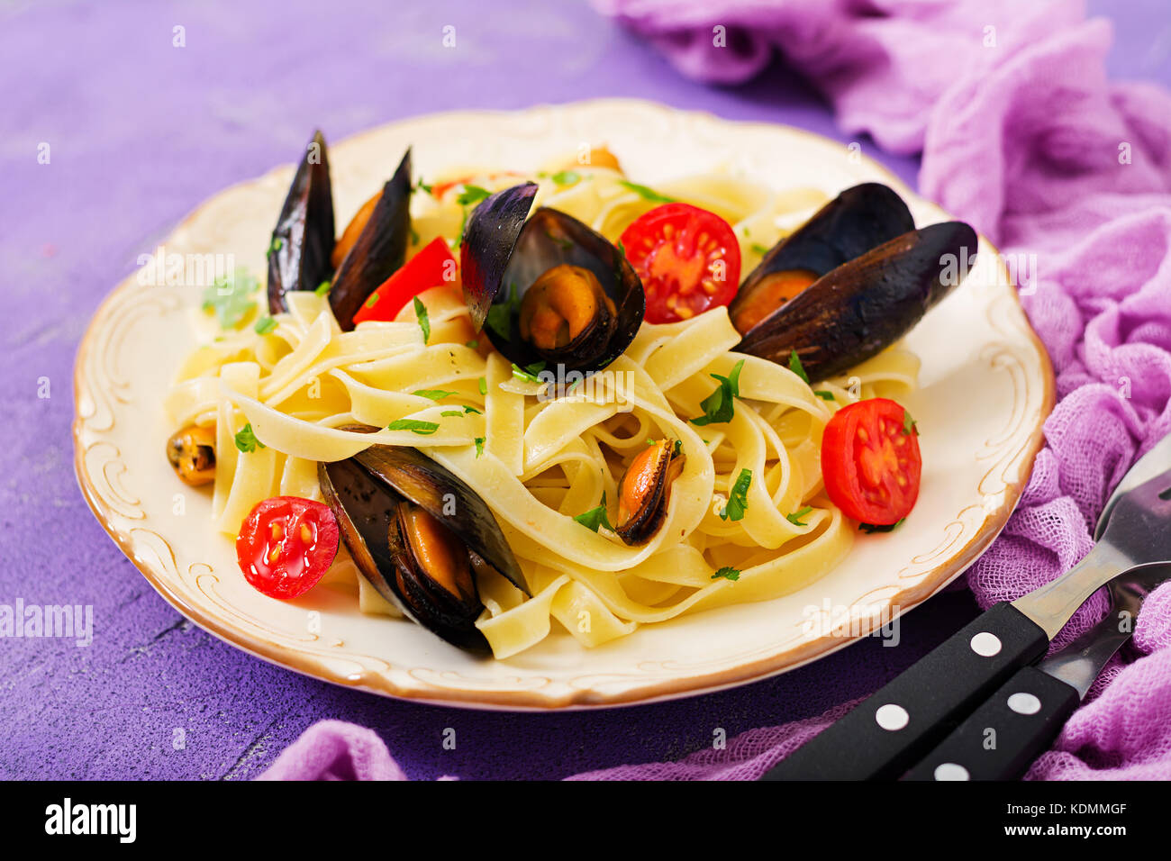 Seafood fettuccine pasta with mussels. Mediterranean delicacy food ...