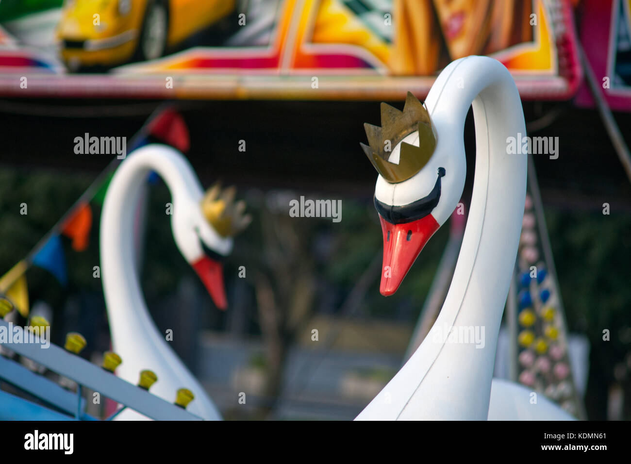 Children riding carousel, swan Stock Photo - Alamy