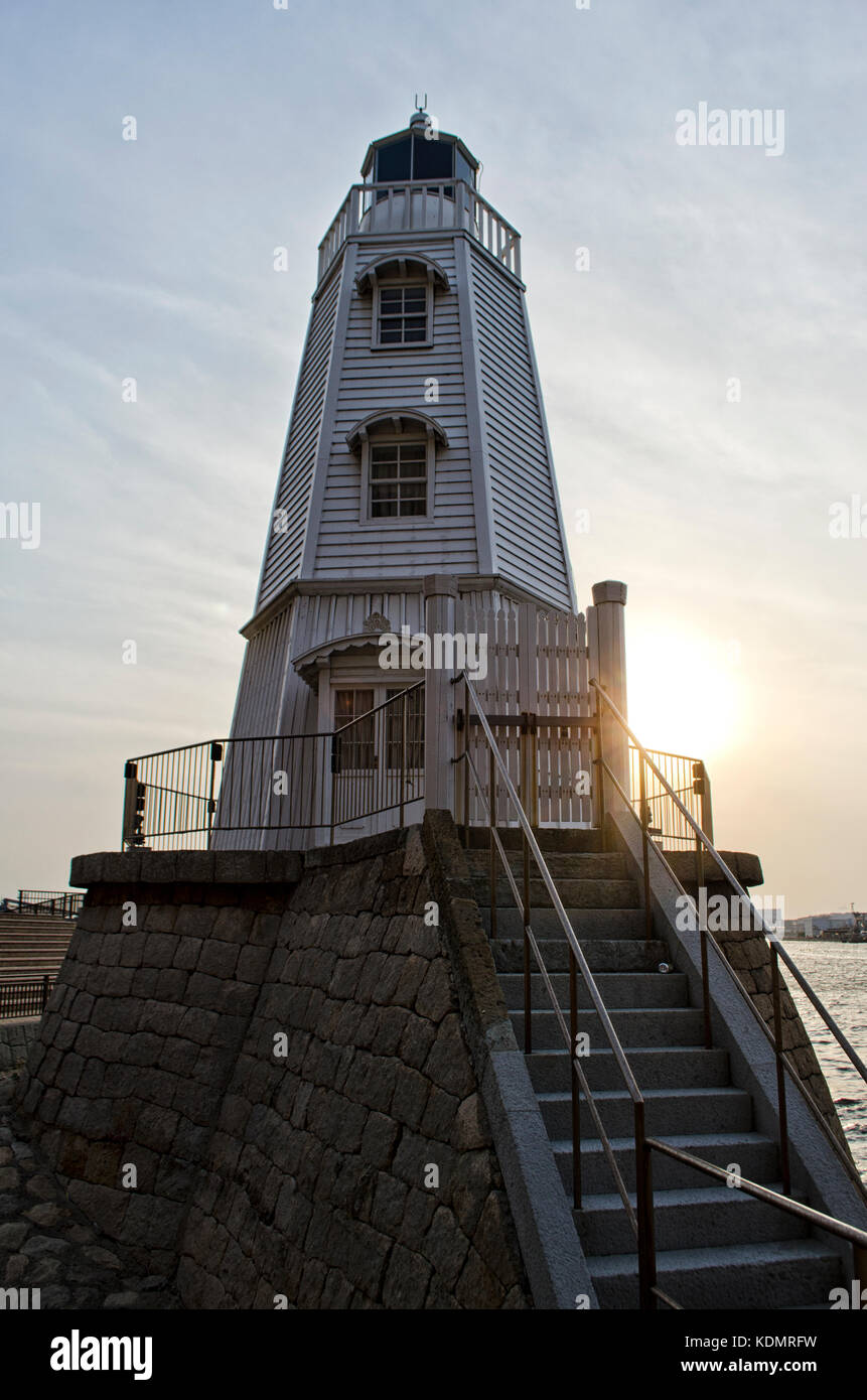 Sun set behind a Wooden Lighthouse Stock Photo - Alamy