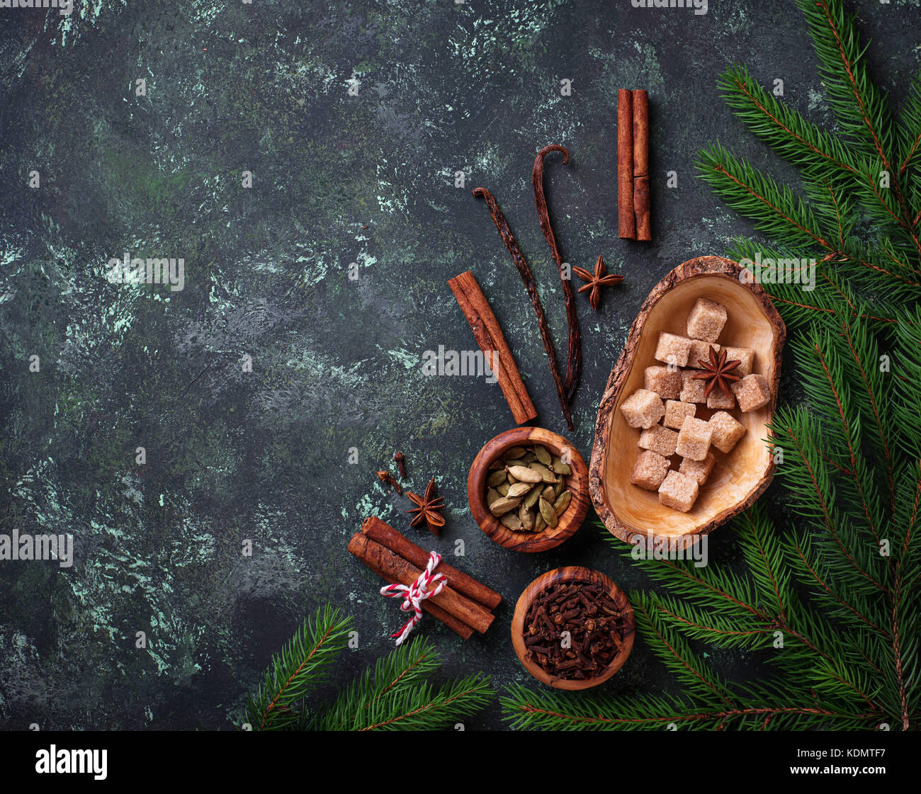 Traditional Christmas spices on green background Stock Photo - Alamy