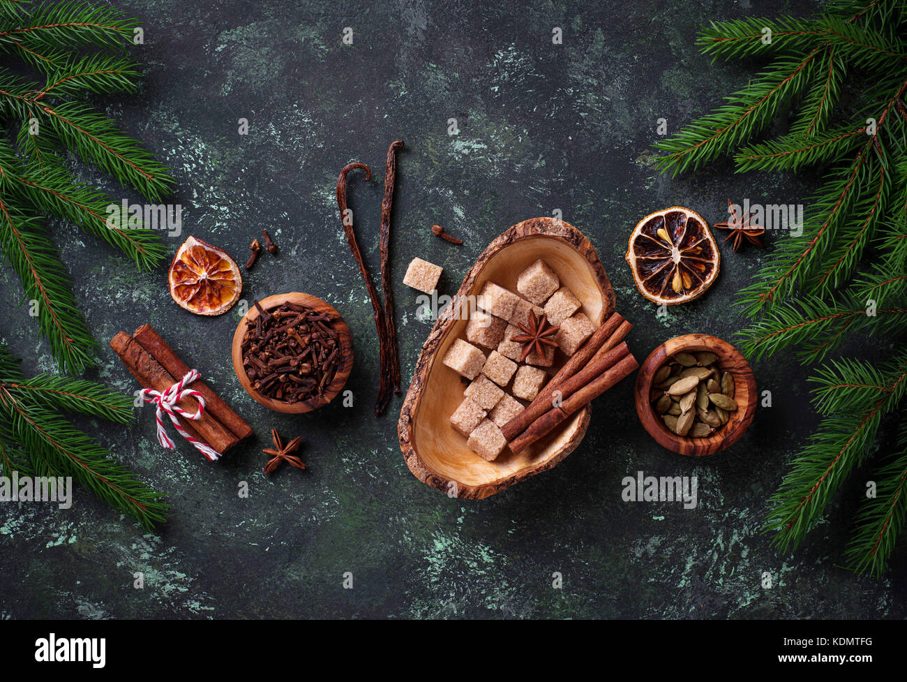Traditional Christmas spices on green background Stock Photo - Alamy