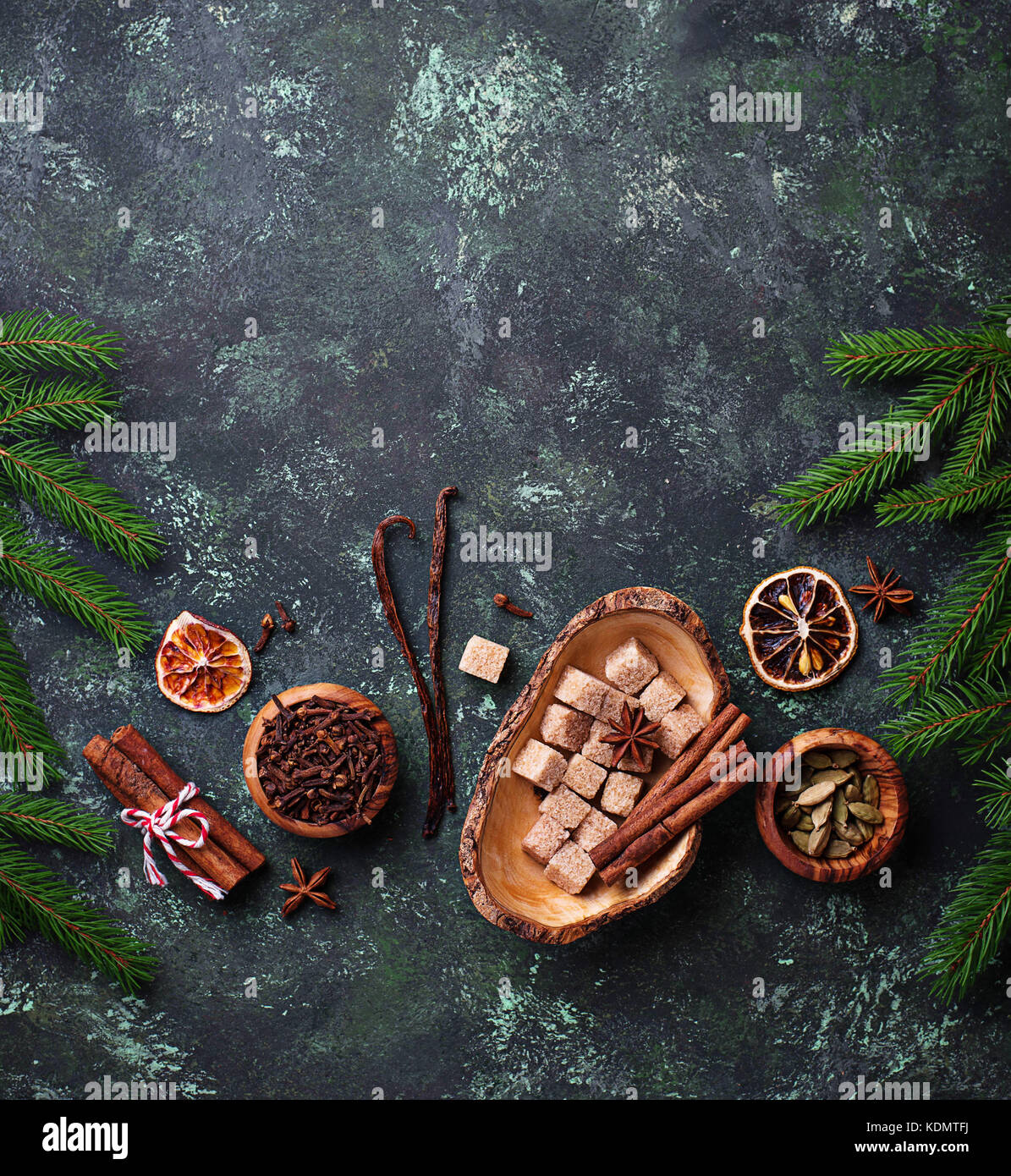 Traditional Christmas spices on green background Stock Photo - Alamy