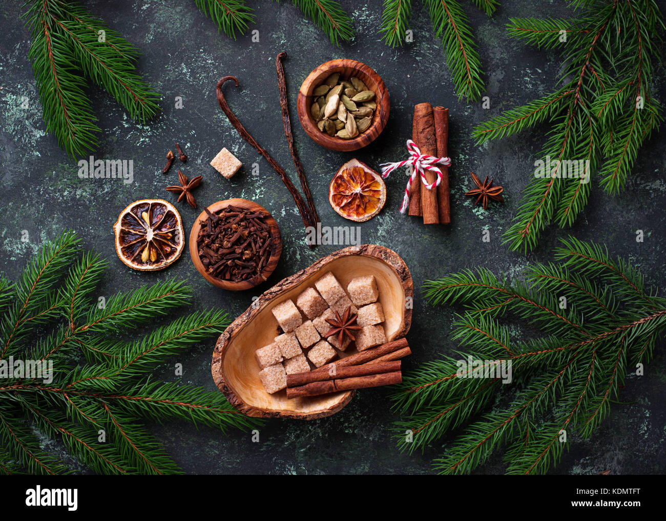 Traditional Christmas spices on green background Stock Photo - Alamy