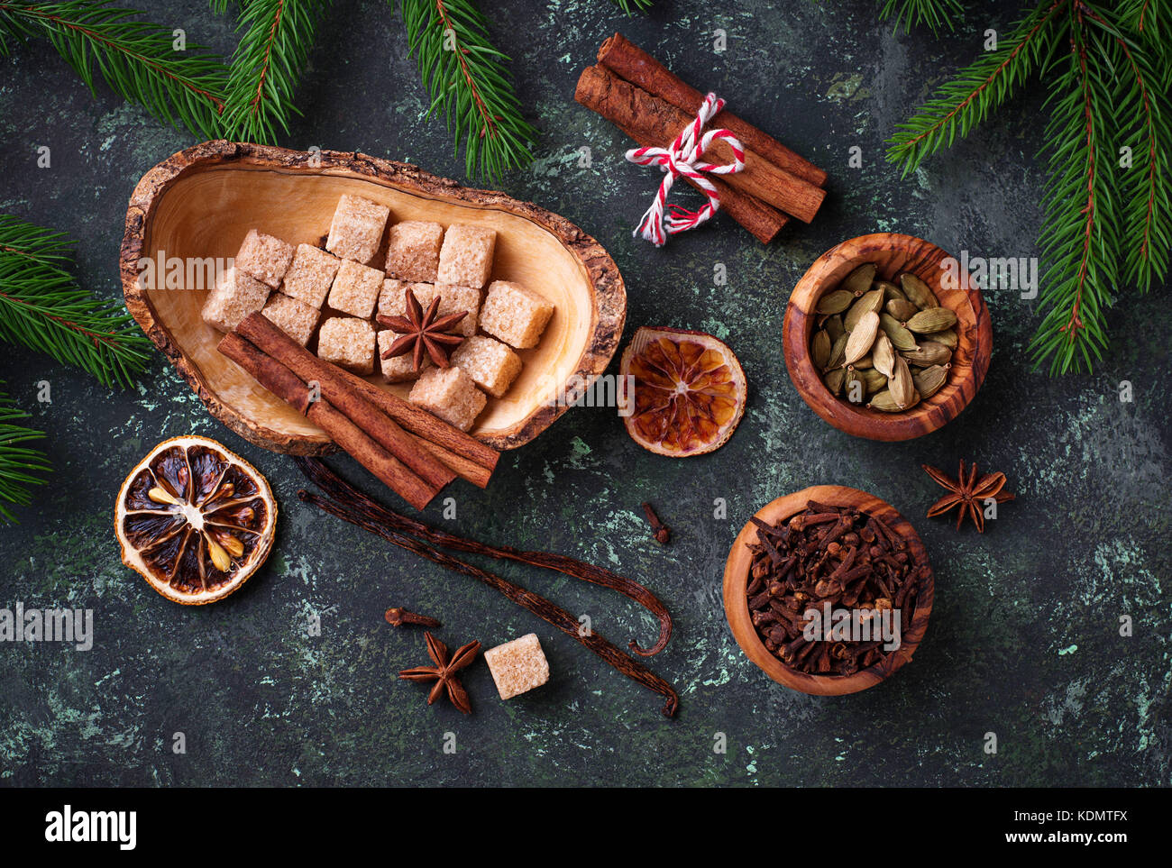 Traditional Christmas spices on green background Stock Photo - Alamy